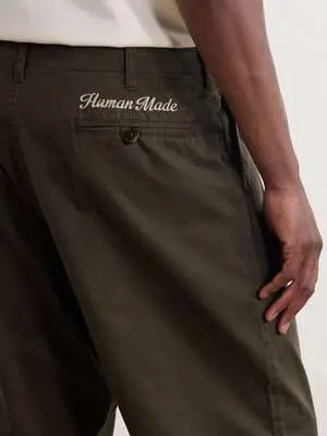HUMAN MADE Tapered Logo-embroidered Pleated Cotton-twill Trousers