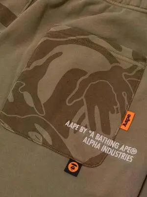 AAPE BY *A BATHING APE X Alpha Industries Moonface Logo-print Track Pants