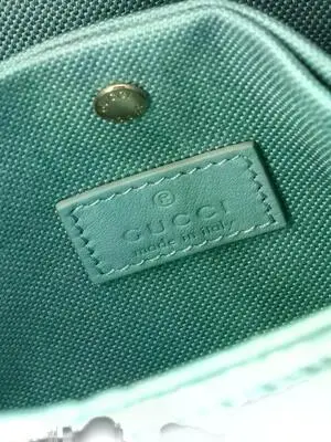 Gucci Emblem Gg Embossed Patent Small Bucket Bag