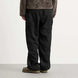 AND WANDER Crinkled Nylon Trousers
