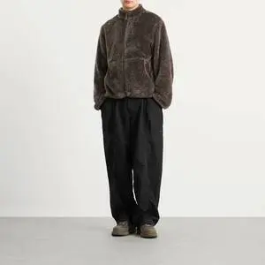 AND WANDER Crinkled Nylon Trousers