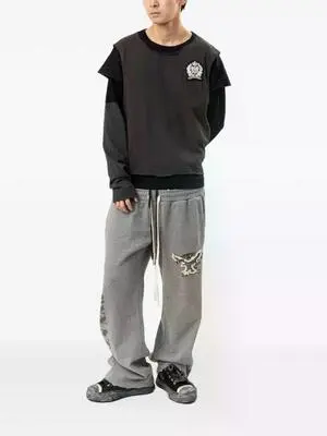 PROTOCOL INDEX Layered Eagle-patch Track Pants
