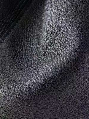 LOUIS VUITTON Lockme Eyelet Leather Backpack