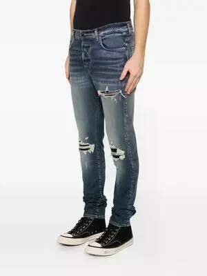 Amiri Ripped-effect Jeans