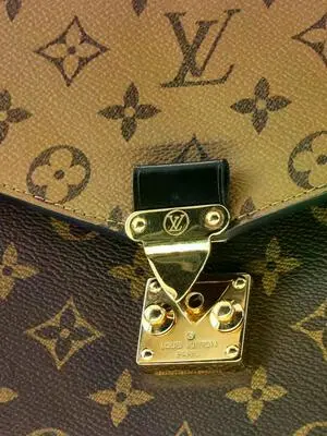 LOUIS VUITTON Pochette Metis Reverse Monogram Canvas Crossbody Bag - Brown
