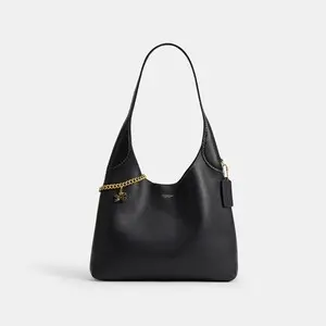 COACH Bow Charm - Brass/black