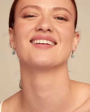 UNODE50 Drop Earrings With Blue Cubic Zirconia