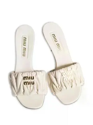 Miu Miu Matelassé Patent Nappa Leather Mules - Neutrals