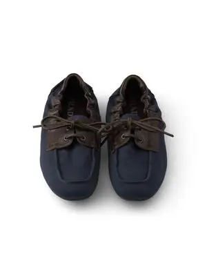 Prada Aged Canvas And Leather Boat Shoes - Blue