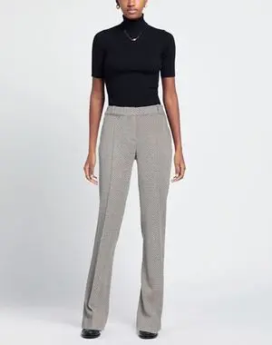 THE MANNEI Flared Herringbone Trousers