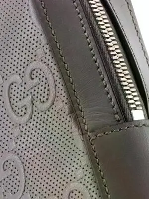 Gucci Sling Gg Embossed Perforated Leather Backpack