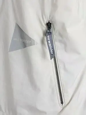 AND WANDER Pertex Quantum Air Logo-print Zip-pocket T-shirt
