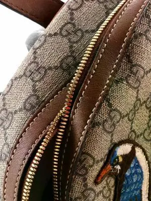 Gucci Zip Pocket Embroidered Gg Coated Canvas Small Backpack - Brown
