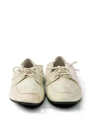Prada Antiqued Leather Boat Shoes With Lettering Logo - Neutrals