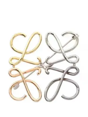 Loewe Silver Pins And Brooches