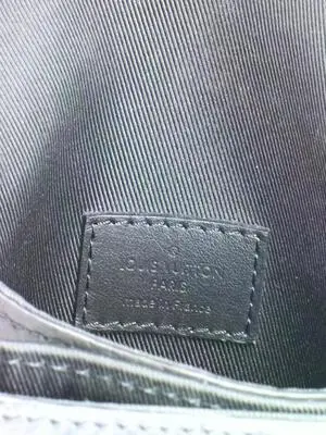 LOUIS VUITTON S Lock Vertical Wearable Wallet Monogram Taurillon Leather - Black