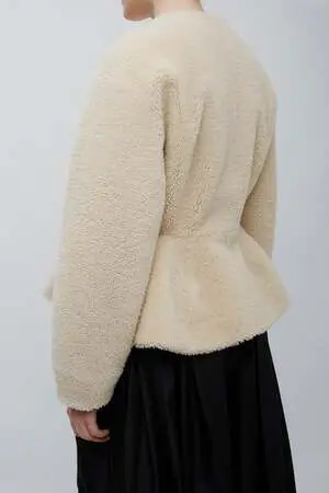 Alaïa Peplum Shearling Jacket