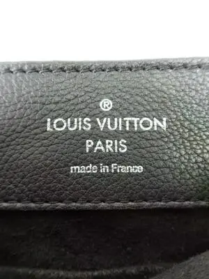 LOUIS VUITTON Lock Me Leather Backpack