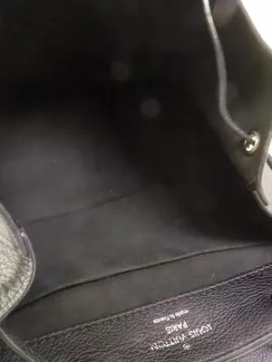 LOUIS VUITTON Lock Me Evergrain Leather Backpack