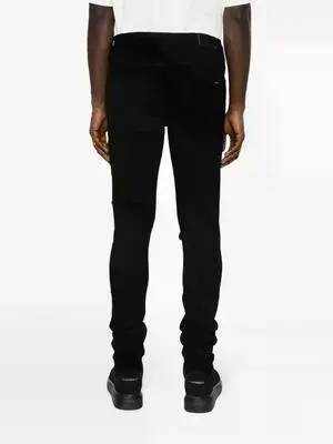 Amiri Cotton Blend Skinny Jeans With Distressed Details - Black