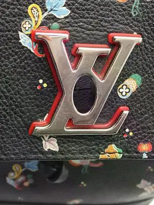 LOUIS VUITTON Taurillon Lockme Backpack