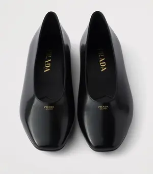 Prada Leather Ballet Flats With Gold Tone Logo Detail - Black