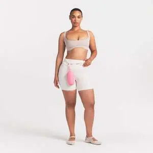 SKIMS Seam Front Micro Bra | White | | Nike Studio Stretch - Linen