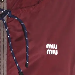 Miu Miu Logo Rubberised Zipped Hooded Jacket - Brown