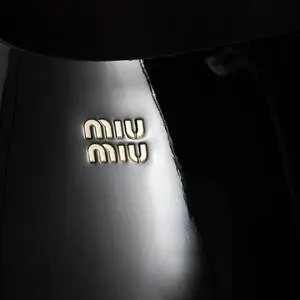 Miu Miu Patent Leather Clogs With Embossed Logo