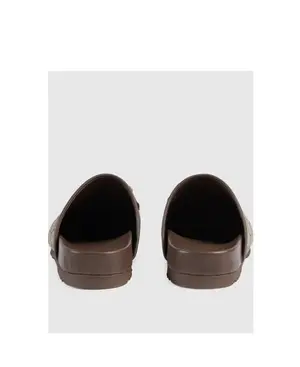 Gucci Monogrammed Gancini Plaque Slides - Nude