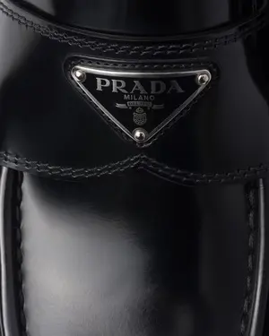 Prada Brushed Leather Loafers With Enameled Metal Logo