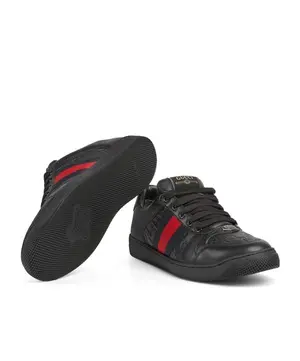 Gucci Embossed Gg Leather Low-top Sneakers - Black