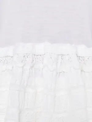 Alaïa High Neck Short Sleeve Top With Ruffled Hem - White
