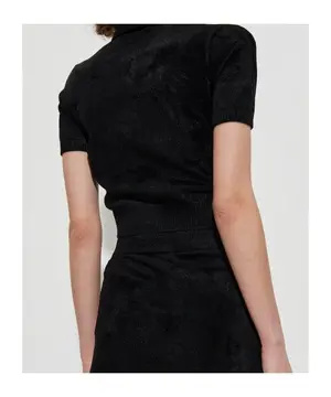 Amiri Cropped Short-sleeved Polo Shirt With Ribbed Accents And Metal Detailing