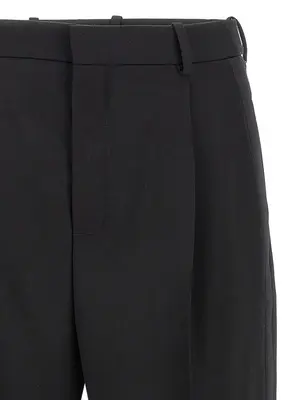 Saint Laurent Wool High-waisted Carrot Leg Pleated Pants With Ribbon Detail