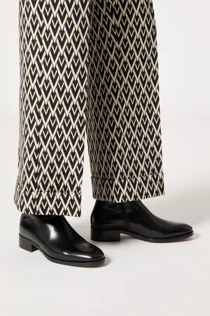 Valentino Garavani Vlogo Plaque Almond Toe Ankle Boots