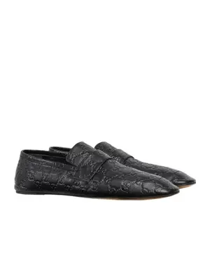 Gucci Logo Embossed Leather Loafers