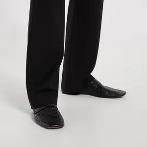 Gucci Logo Embossed Leather Loafers