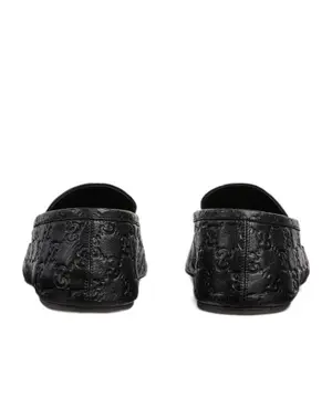 Gucci Logo Embossed Leather Loafers