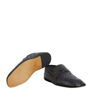 Gucci Logo Embossed Leather Loafers