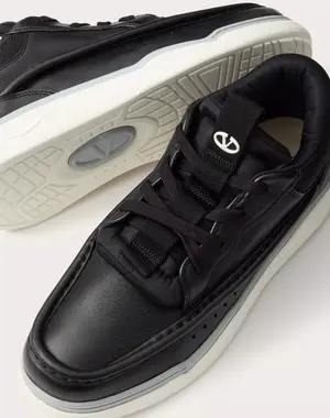 Valentino Garavani Logo Embossed Lace-up Sneakers - Black