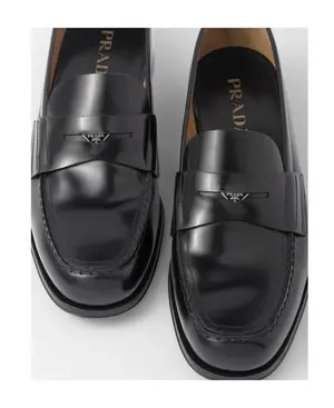 Prada Brushed Leather Slip-on Penny Loafers With Enameled Triangle Logo - Black