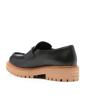Prada Logo Plaque Round Toe Loafers