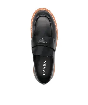 Prada Logo Plaque Round Toe Loafers