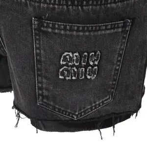 Miu Miu Low Waist Denim Shorts With Logo Detail