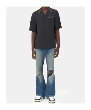 Amiri Ripped Knee Bootcut Denim Jeans