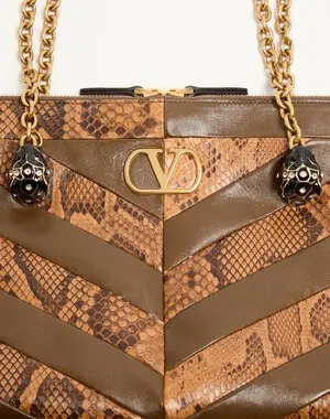 Valentino Garavani Leather And Embossed Shoulder Bag With Studded Strap