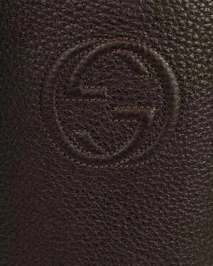 Gucci Embossed Logo Leather Boots