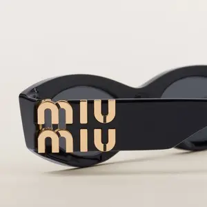 Miu Miu Cat Eye Sunglasses With Logo Detail - Black/gray