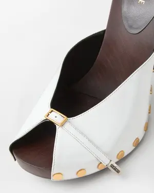 Versace Patent Leather Clogs With Wooden Sole And Metal Embellishments